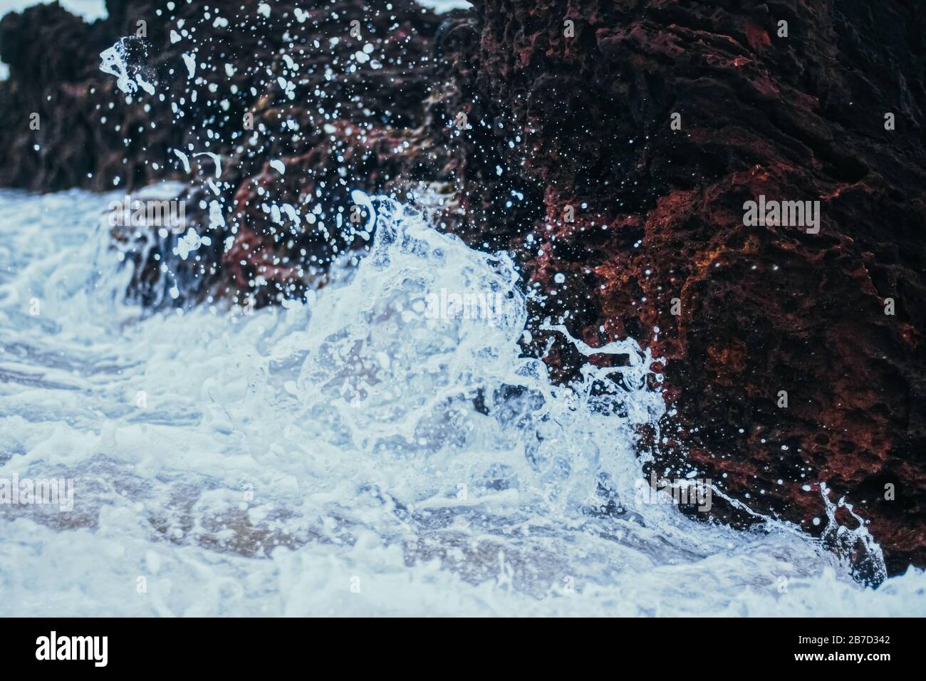 Storm in the ocean, sea waves crashing on rocks on the beach coast ...