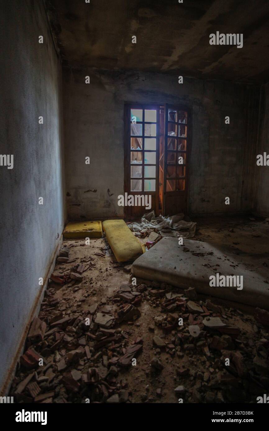 Abandoned and dirty place with door to the countryside Stock Photo - Alamy