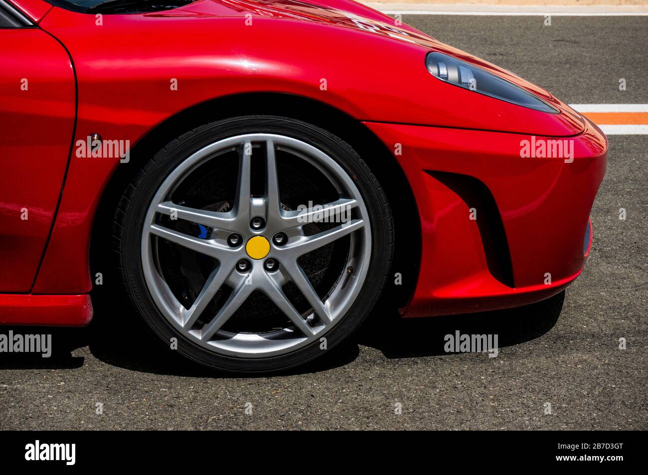 Red sport car race in circuit Stock Photo - Alamy