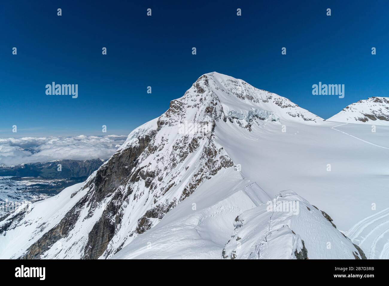 Panoramic view on winter snowy mountains at nice sunny evening. Swiis ...