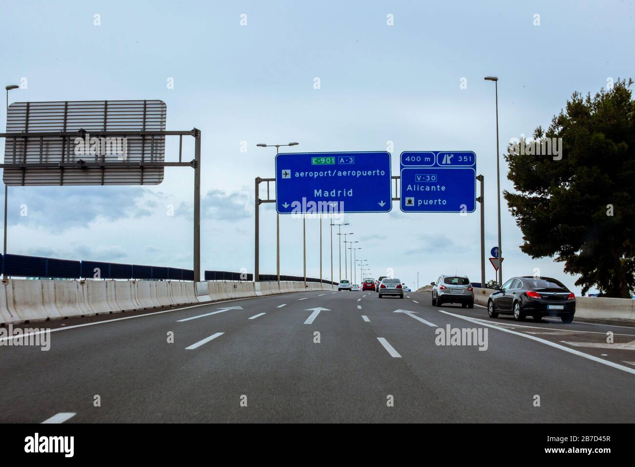 Cars on the road with traffic signs and lines Stock Photo - Alamy