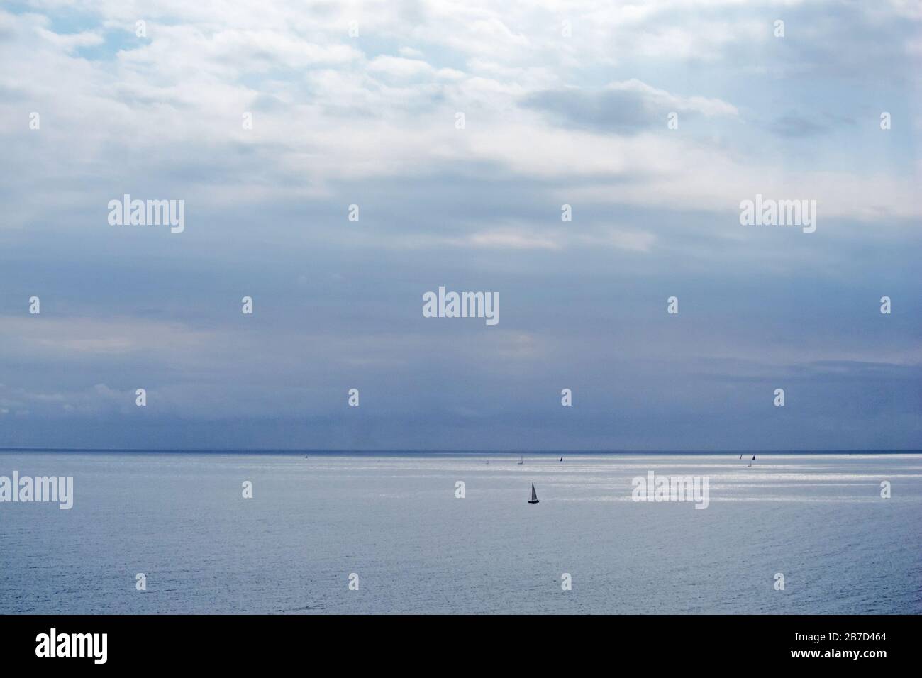Blue calm seascape sail boat hi-res stock photography and images - Alamy