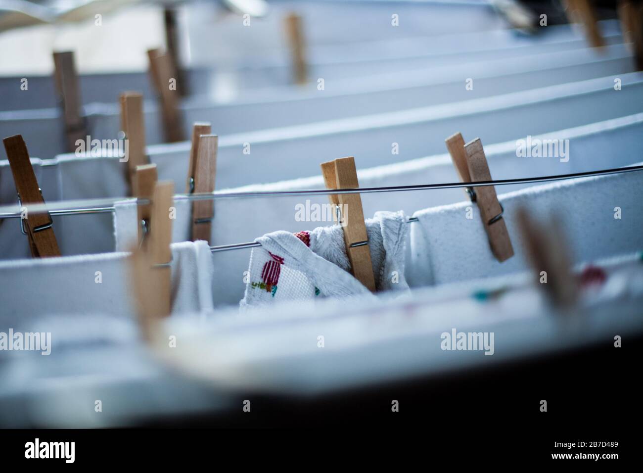 Clothes pegs on the clothesline with cotton white clothes Stock Photo ...