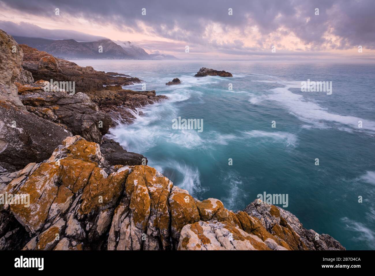 A beautiful golden early evening seascape photographed on a stormy day ...