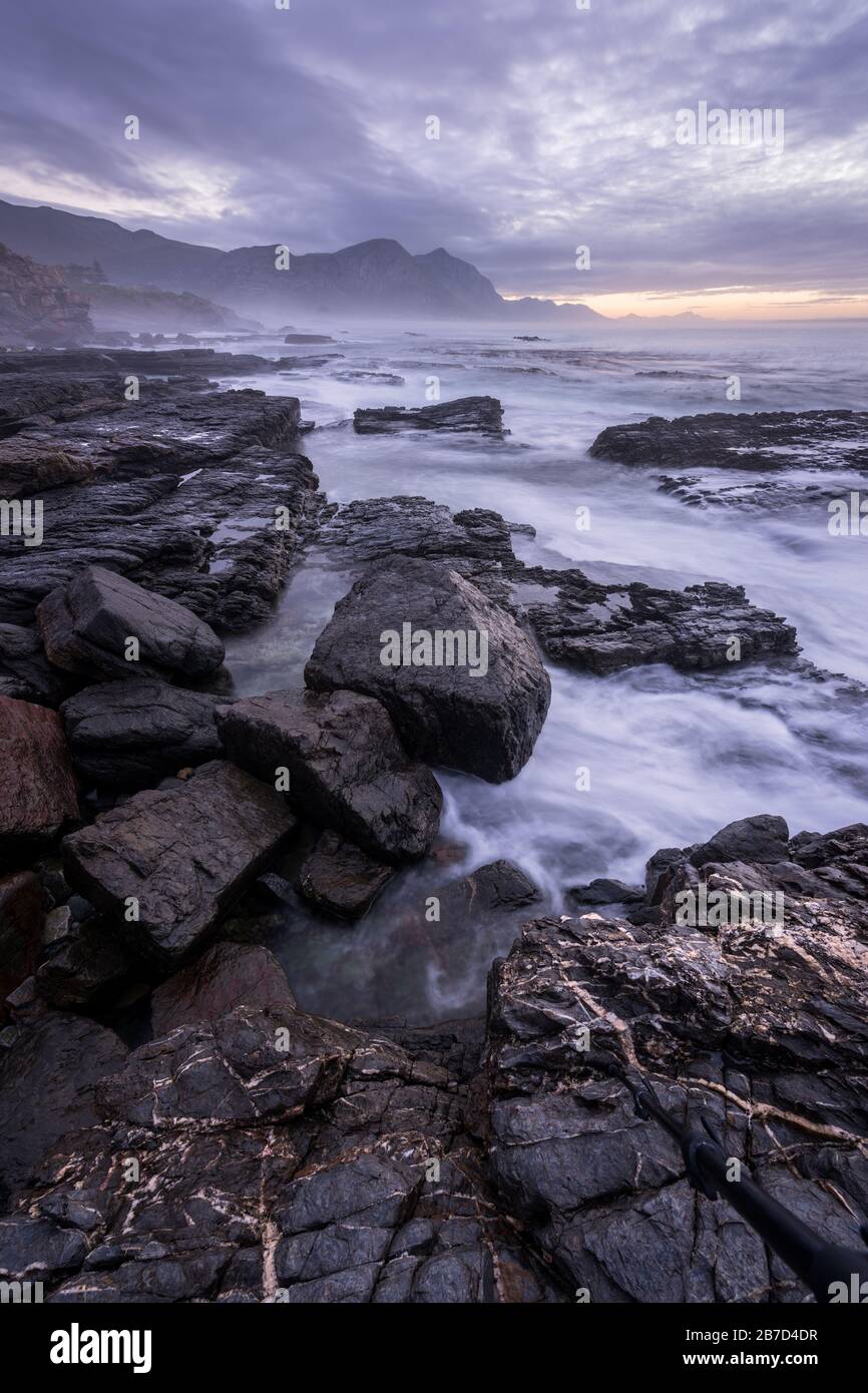 A beautiful early morning seascape photographed vertically on a stormy ...