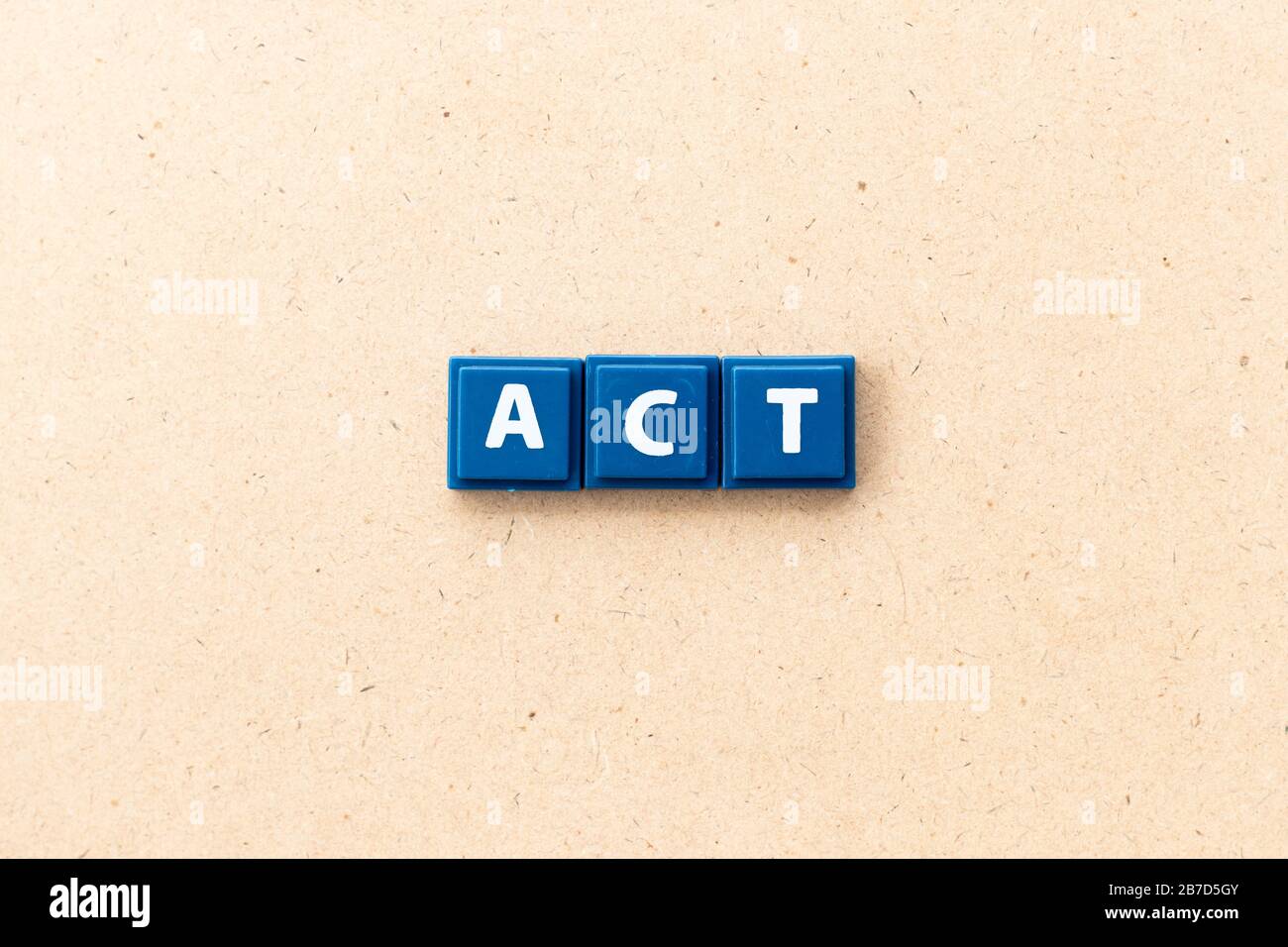 Tile letter in word act on wood background Stock Photo - Alamy