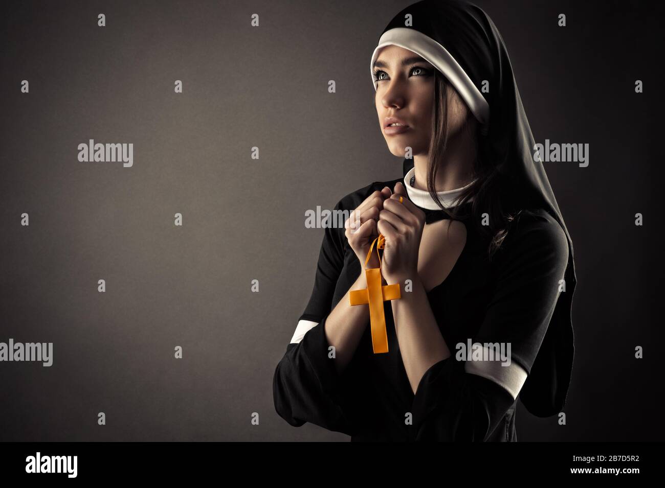 beautiful young nun prays to god Stock Photo - Alamy
