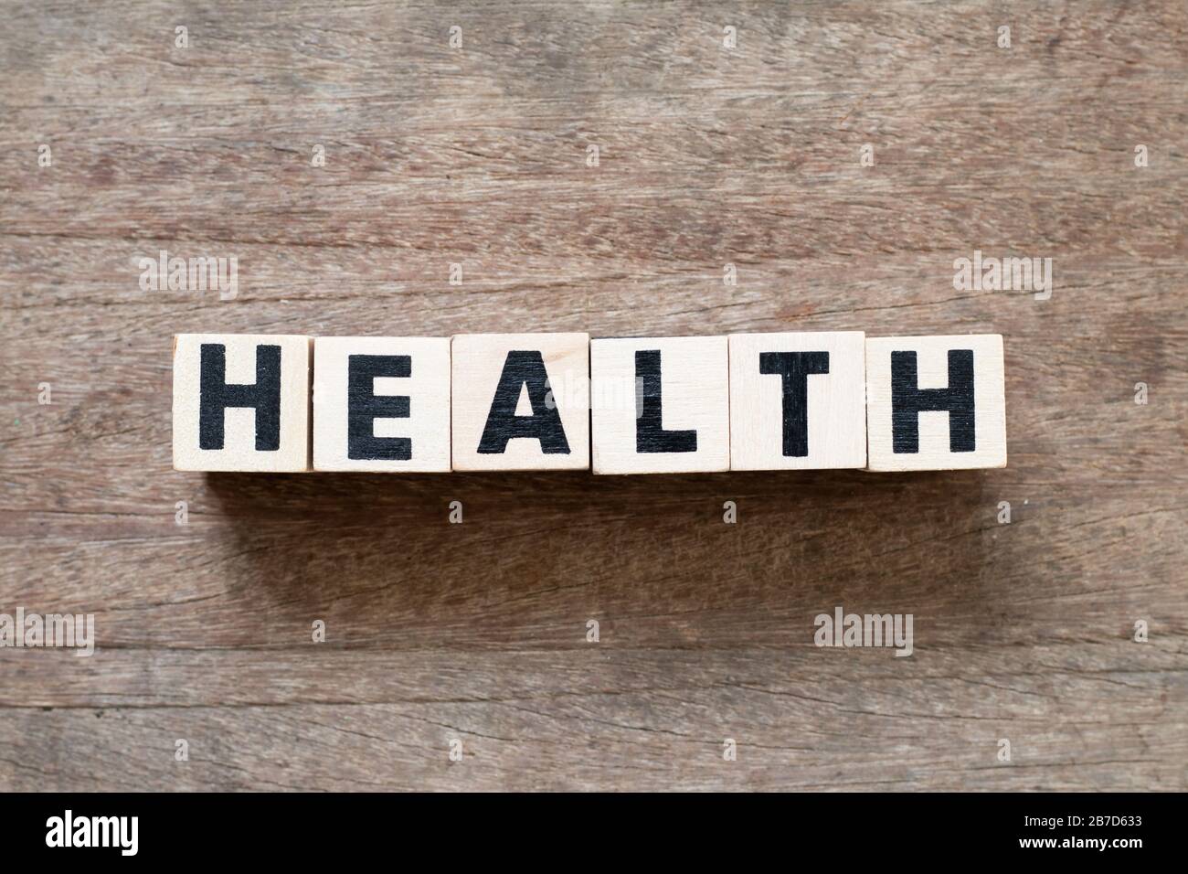 Letter block in word health on wood background Stock Photo - Alamy