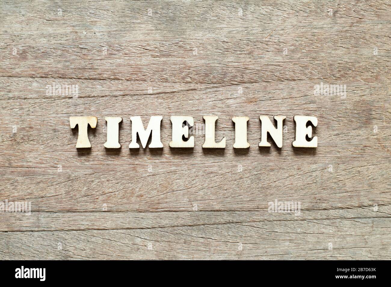 Letter block in word timeline on wood background Stock Photo - Alamy