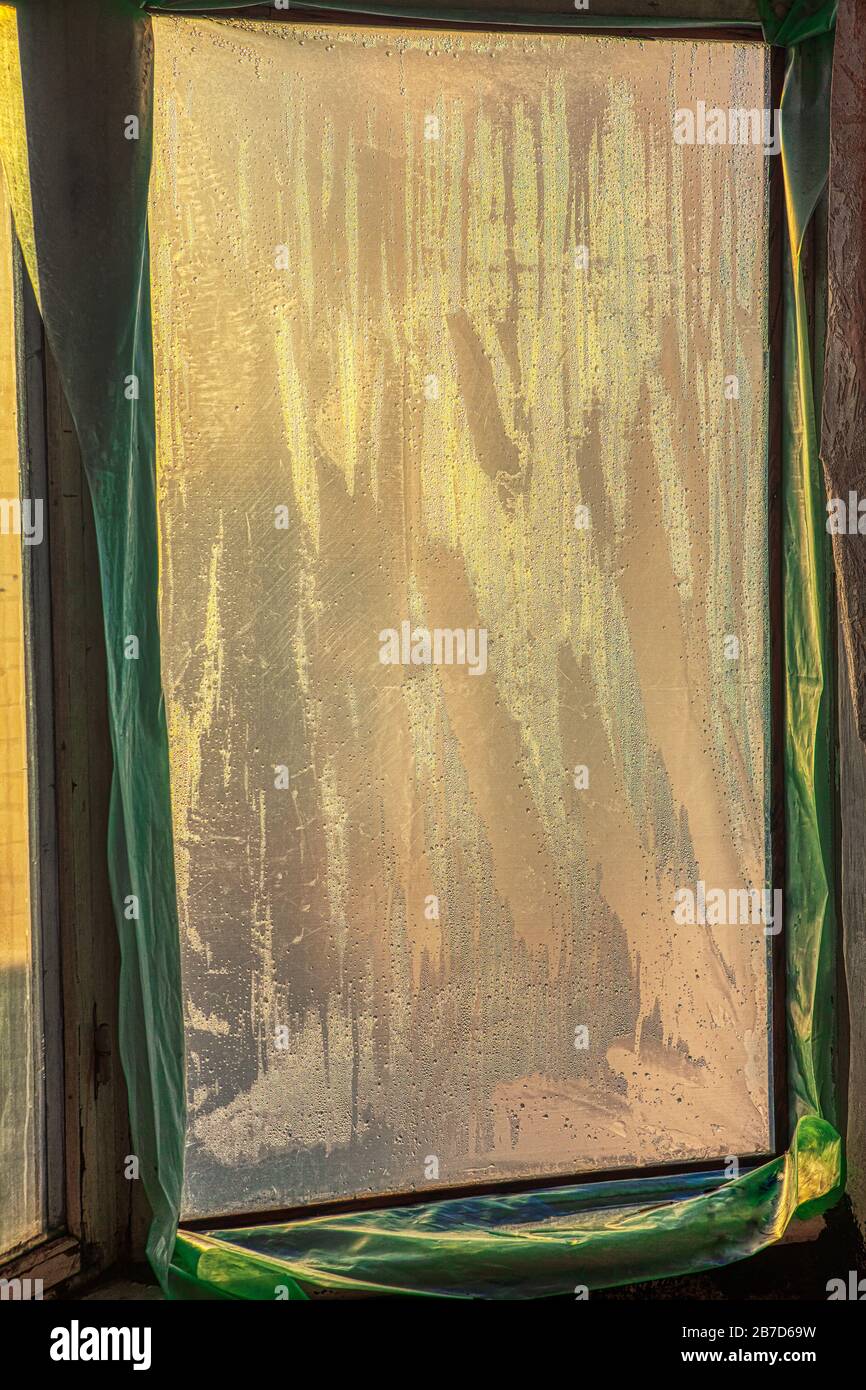 old window covered by transparent plastic Stock Photo - Alamy