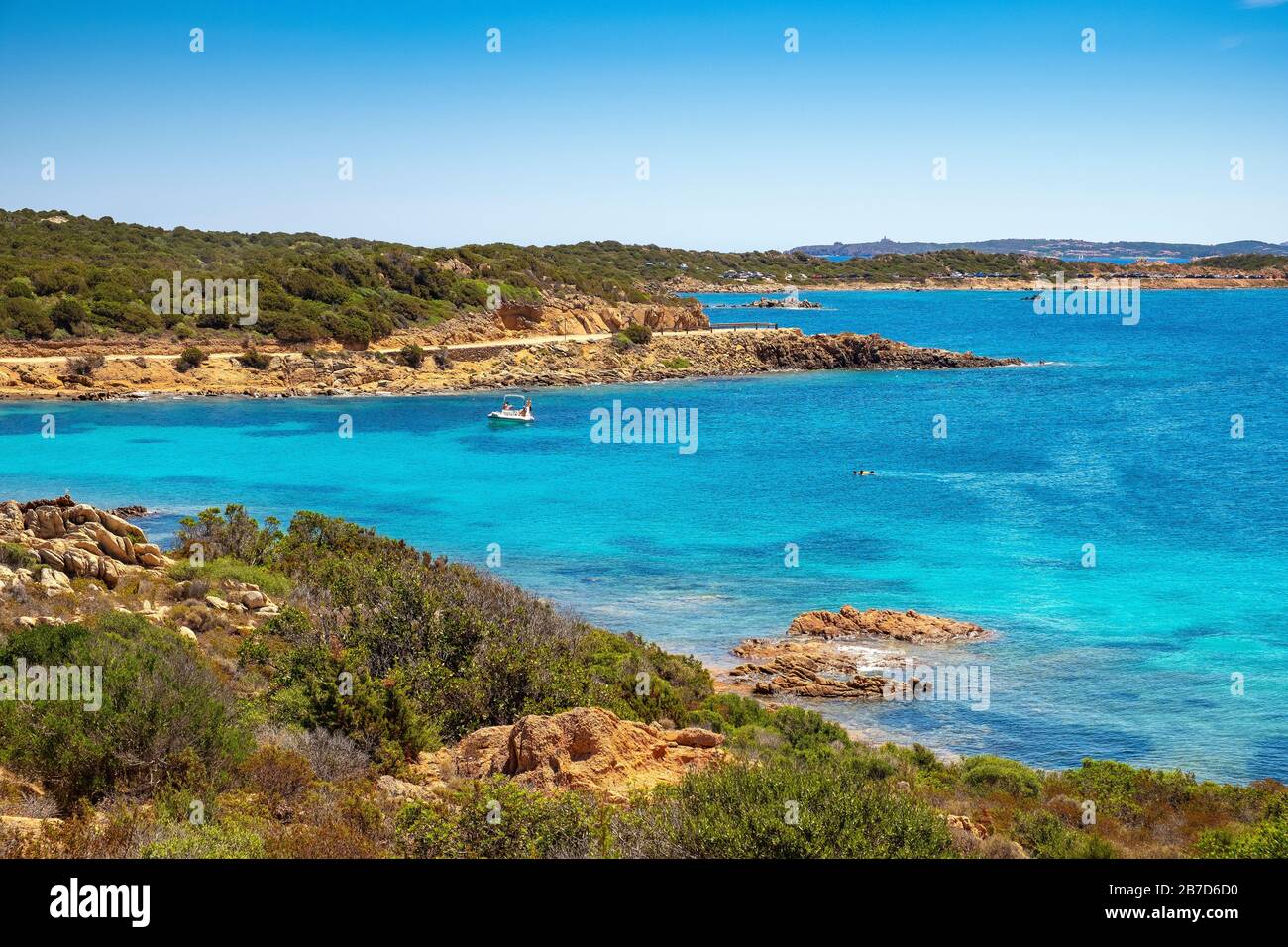 Panoramic view of Caprera Island and Spiaggia di Cala Portese harbor at ...