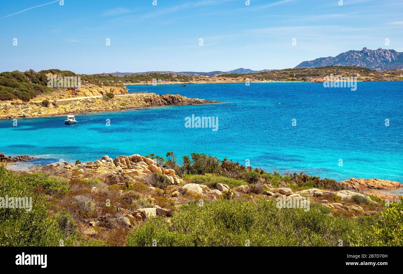 Panoramic view of Caprera Island and Spiaggia di Cala Portese harbor at ...