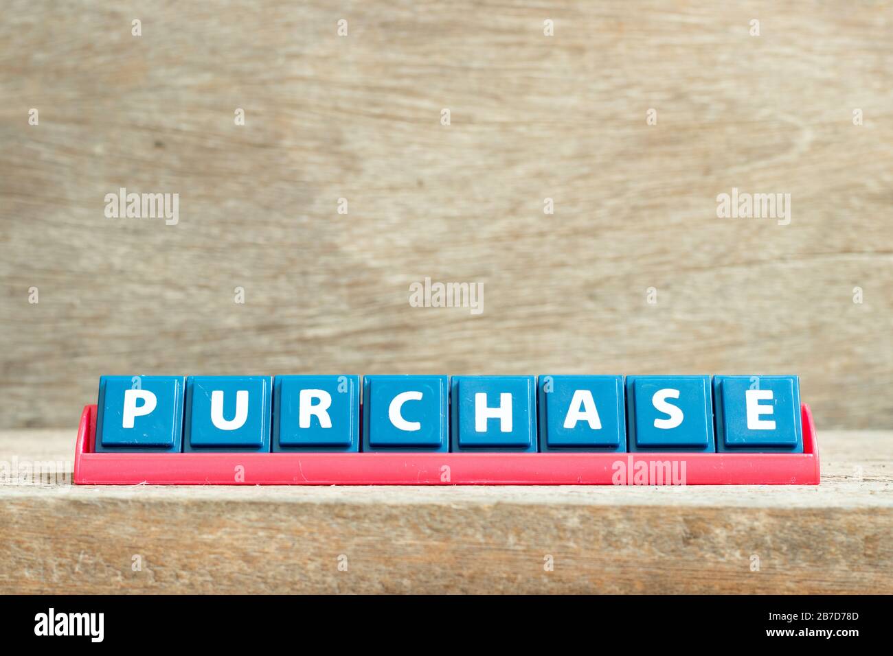 Tile letter on red rack in word purchase on wood background Stock Photo ...
