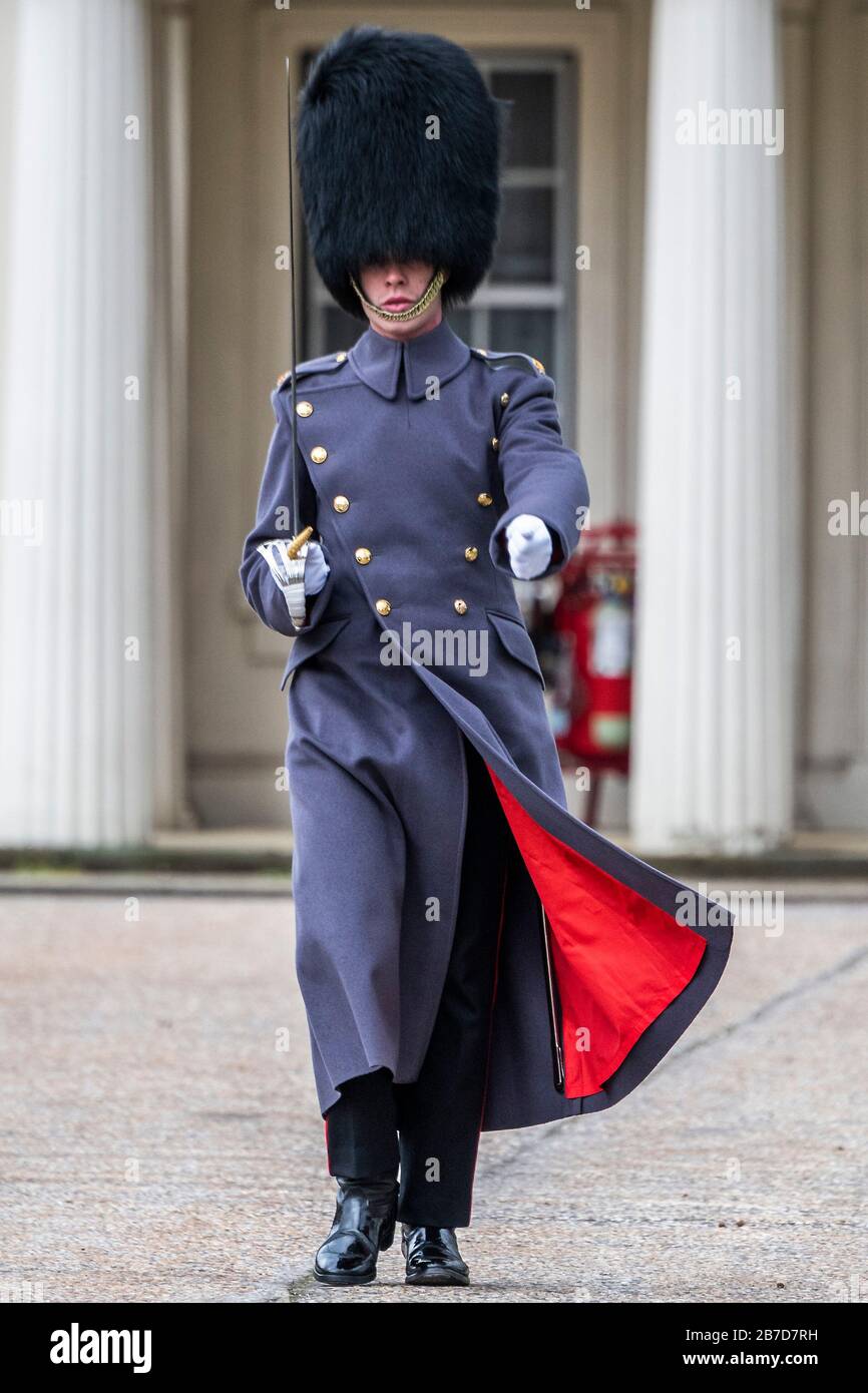 London, UK. 15th Mar, 2020. The Coldstream Guards return to barracks after changing the Guard at ...