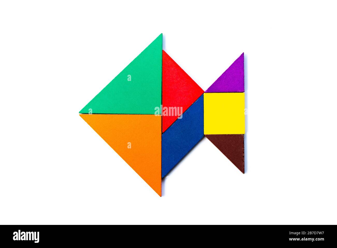 Color wood tangram puzzle in fish shape on white background Stock Photo ...
