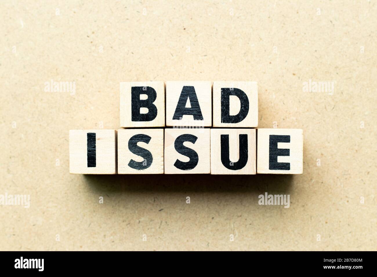 Letter block in word bad issue on wood background Stock Photo - Alamy