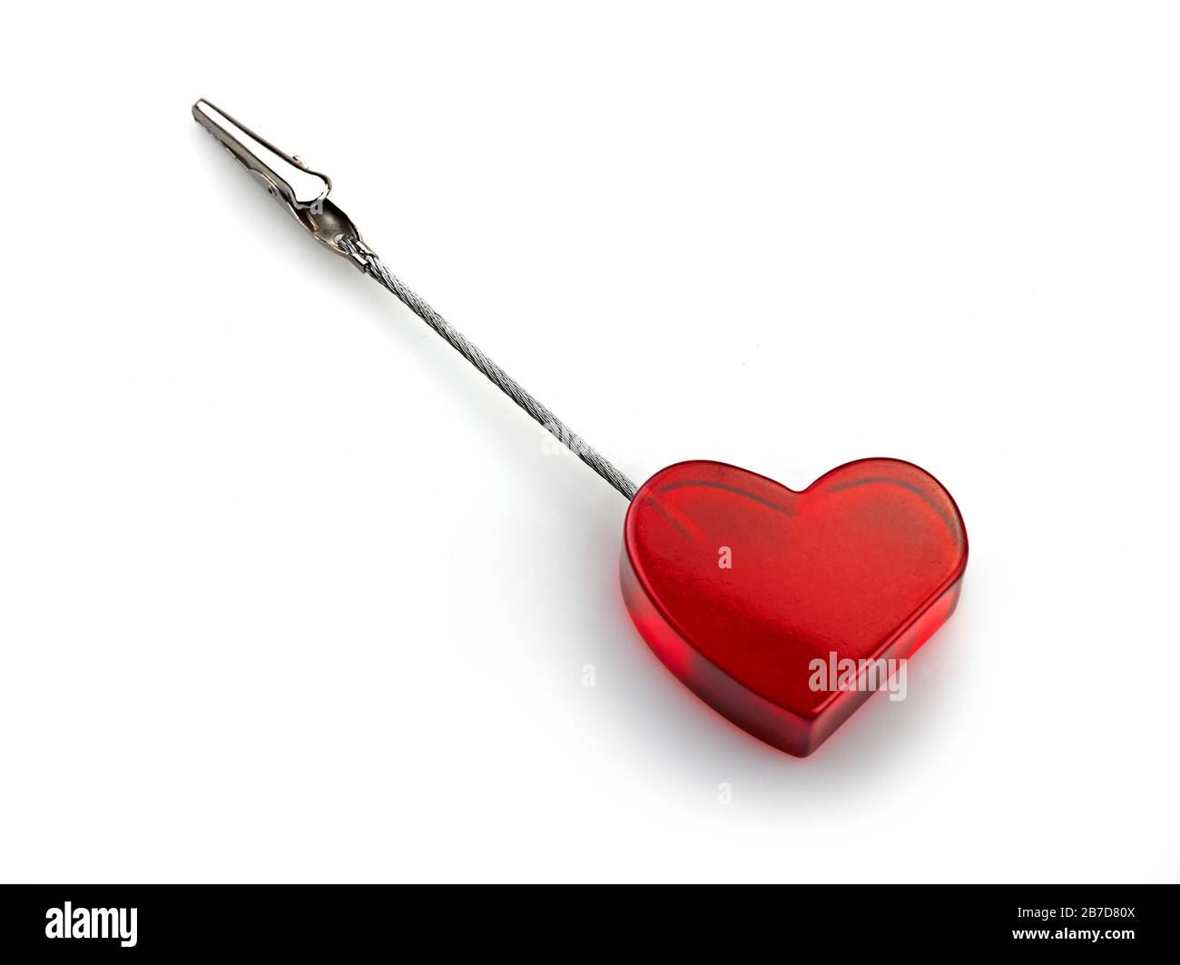 Lovely pinned red heart shape on White background Stock Photo - Alamy