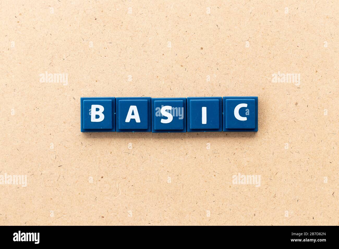 Tile letter in word basic on wood background Stock Photo - Alamy
