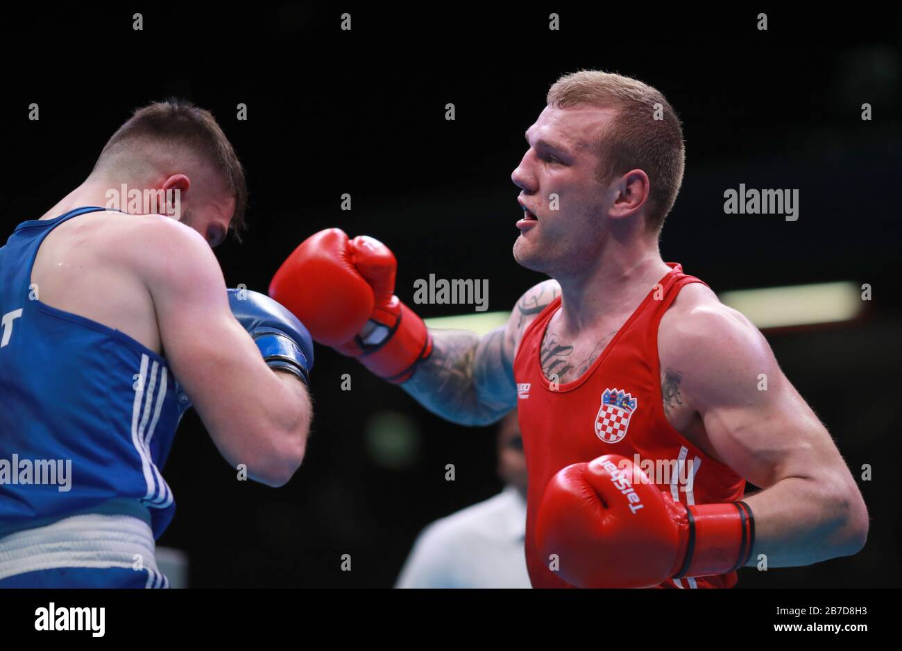 Croatia's Luka Plantic (red) defeats Austria's Umar Dzambekov (blue ...