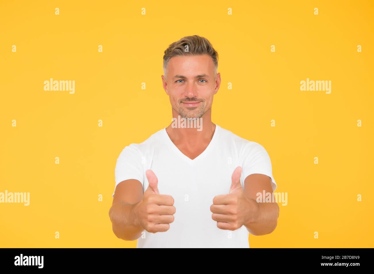 Visual advertising. Happy guy show thumbs ups. Advertising agent yellow ...