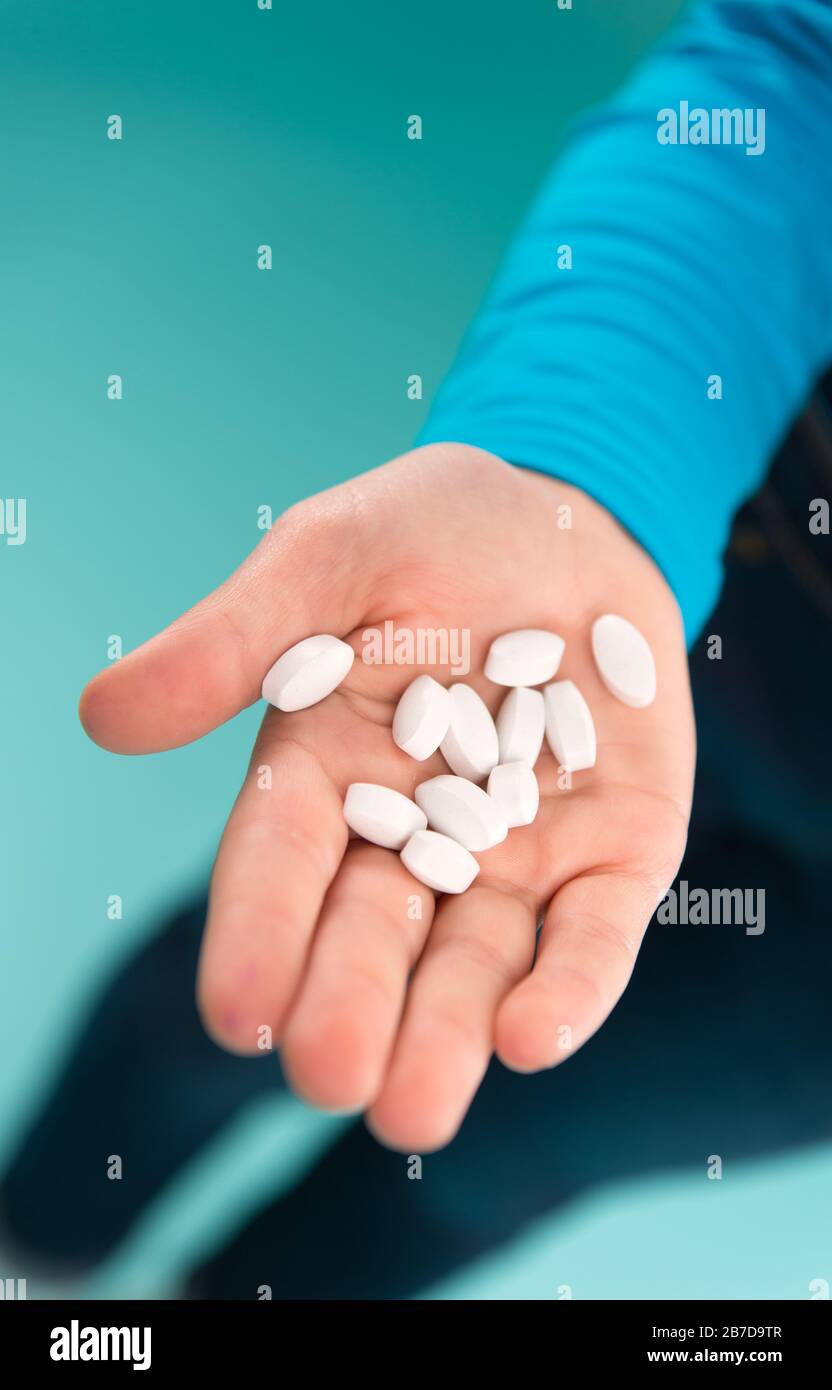 Take your pills. Pills on human hand. Prescribed and dispensed pills ...