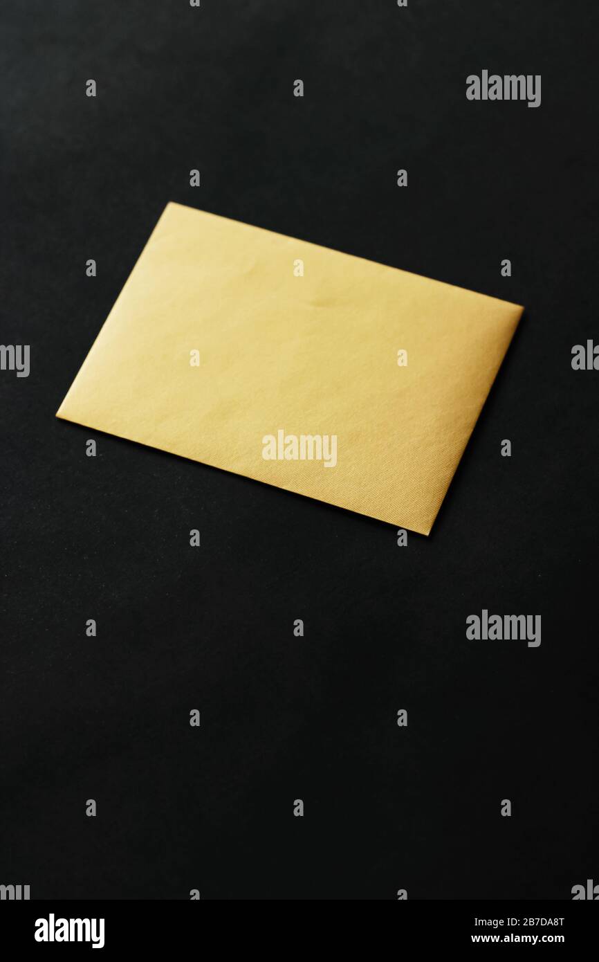 Blank golden paper card on black background, premium business and ...