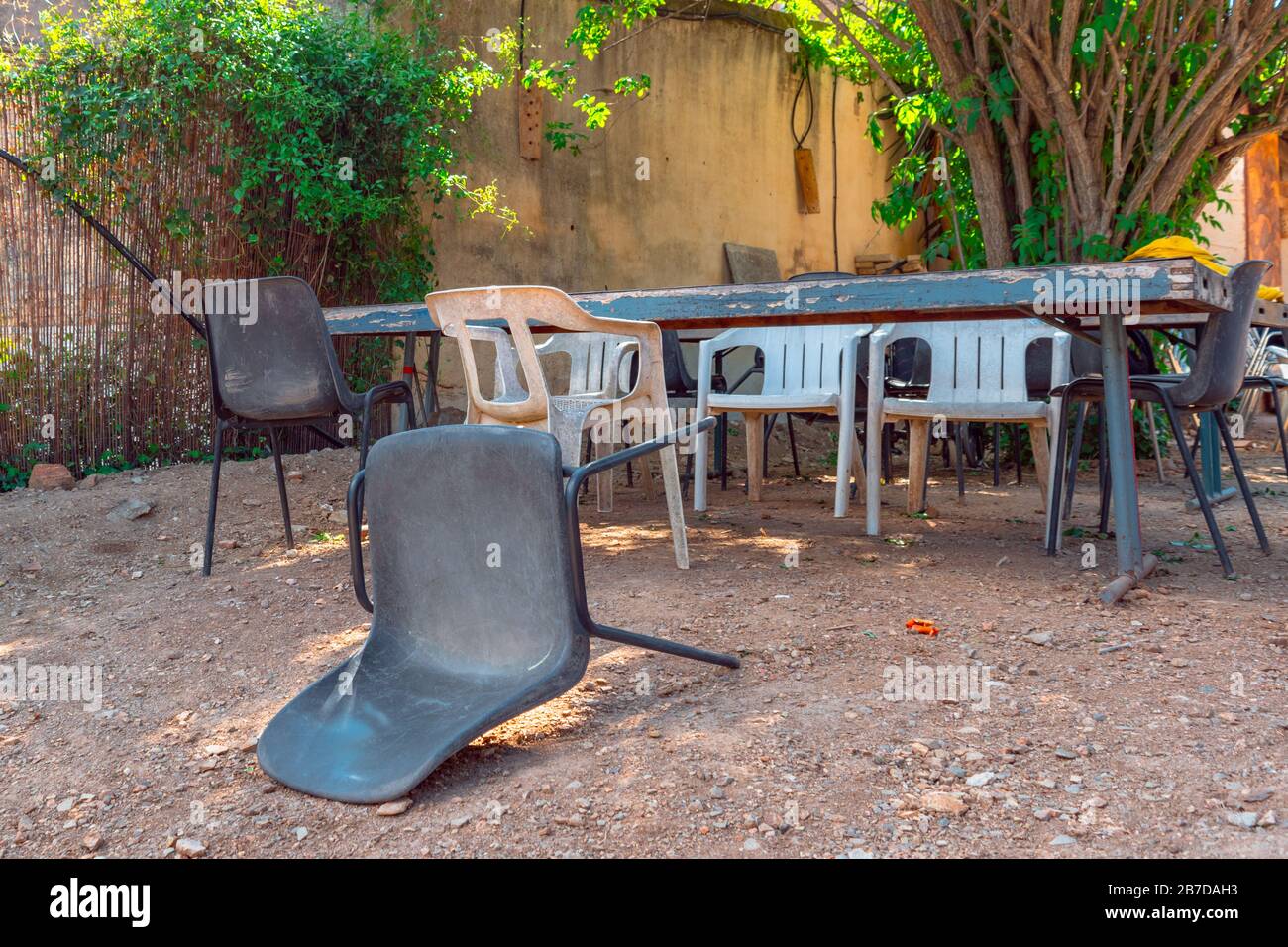 Abandoned plastic white chair hi-res stock photography and images - Alamy