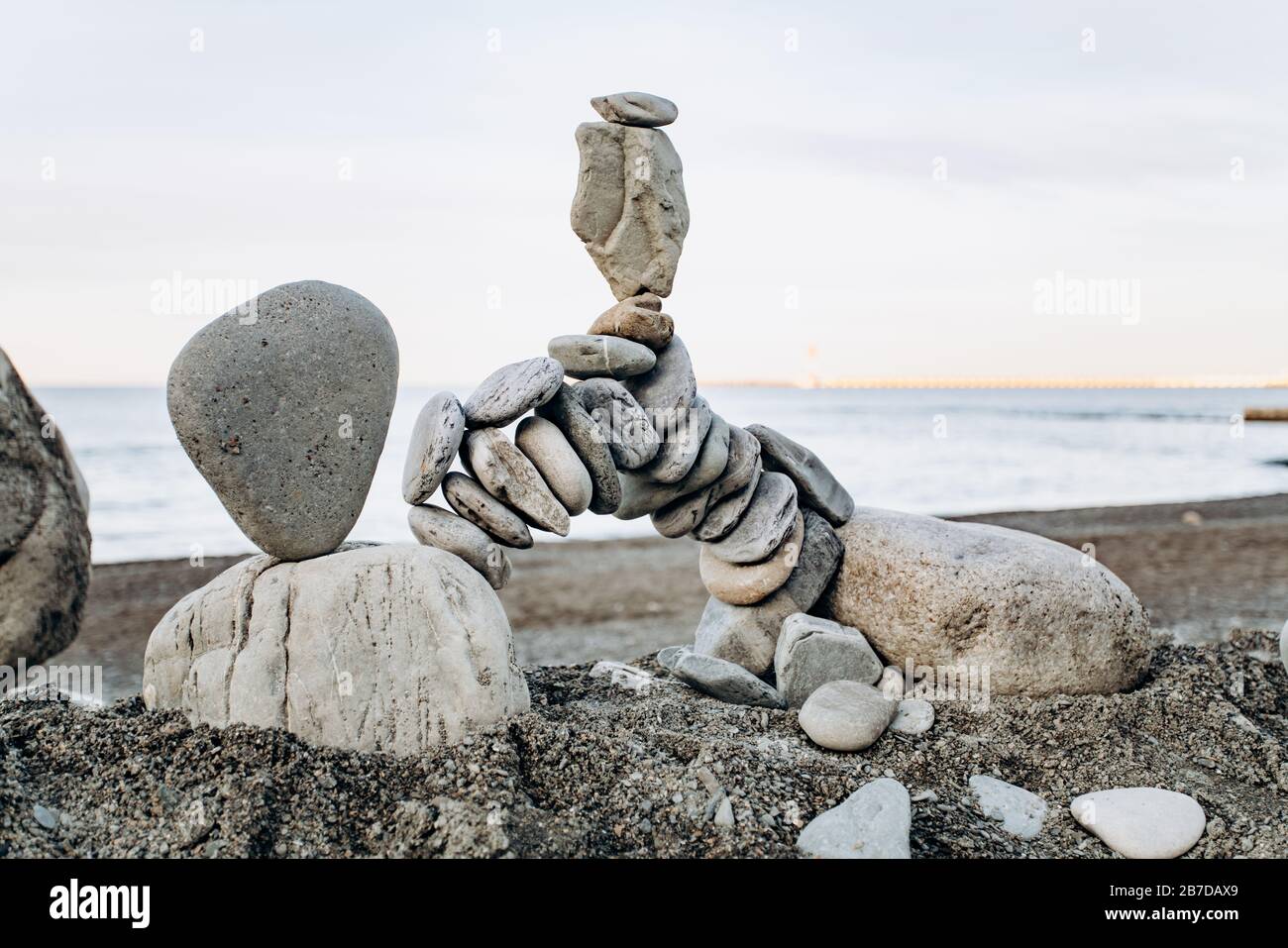 Figures of stones on the beach near the sea. Sea background and stone ...