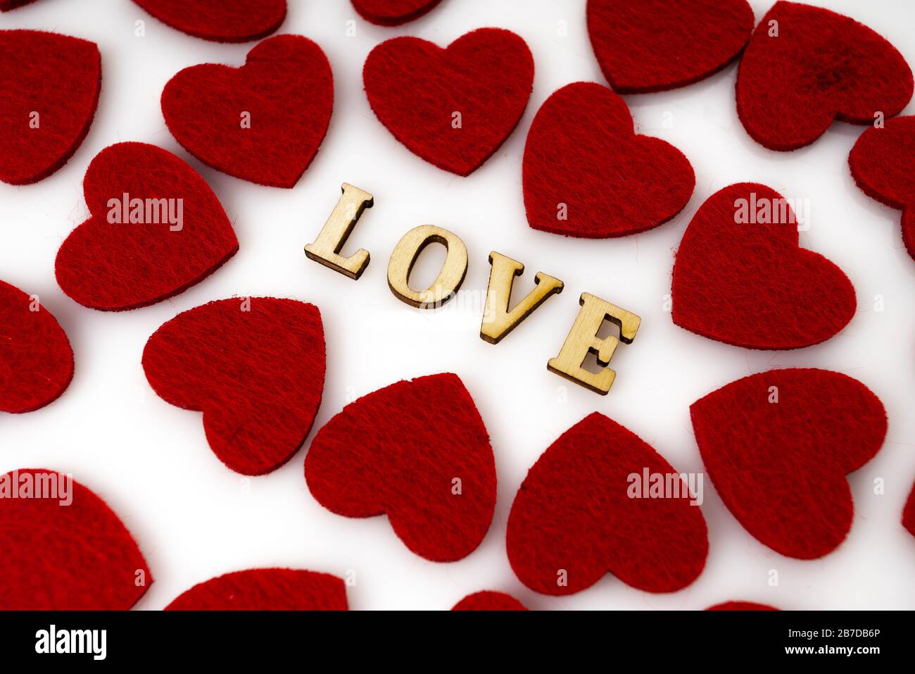 Lettering LOVE with red heart on white Stock Photo - Alamy