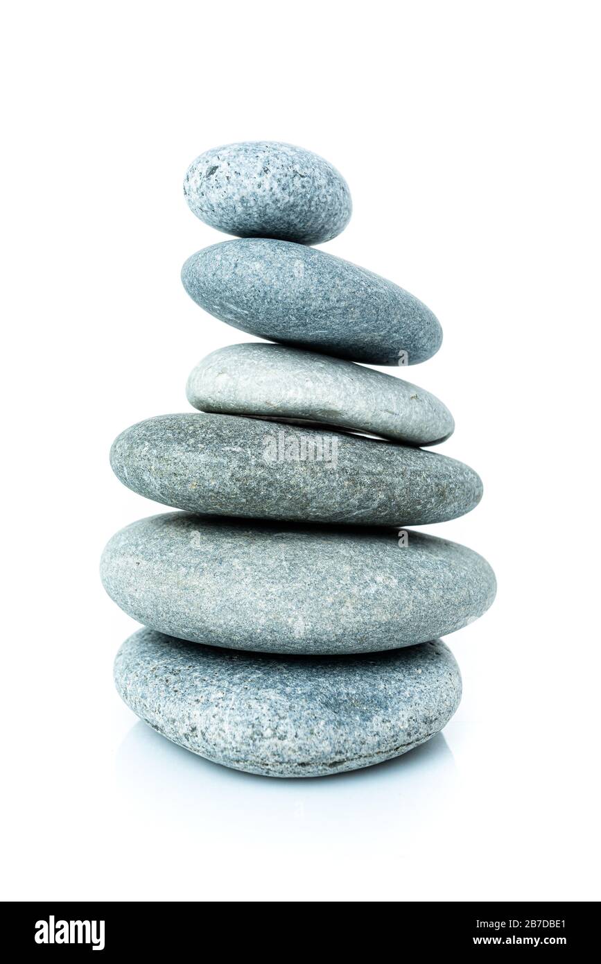 Stacked harmony stones in zen balance. pile of stones isolated on white ...