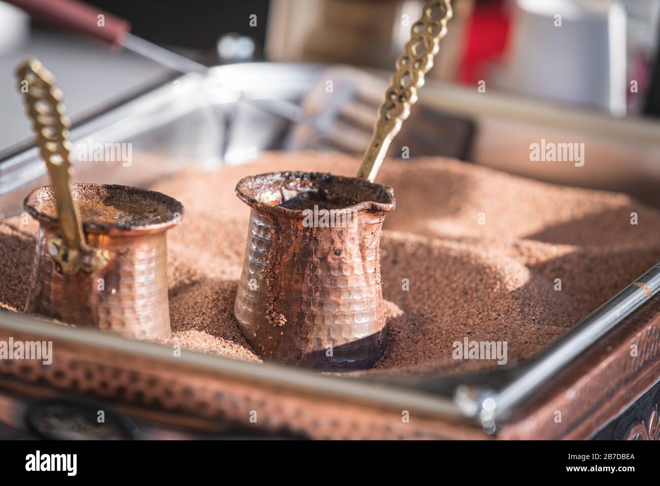 Preparation of Turkish coffee in the cezve in the sand Stock Photo - Alamy