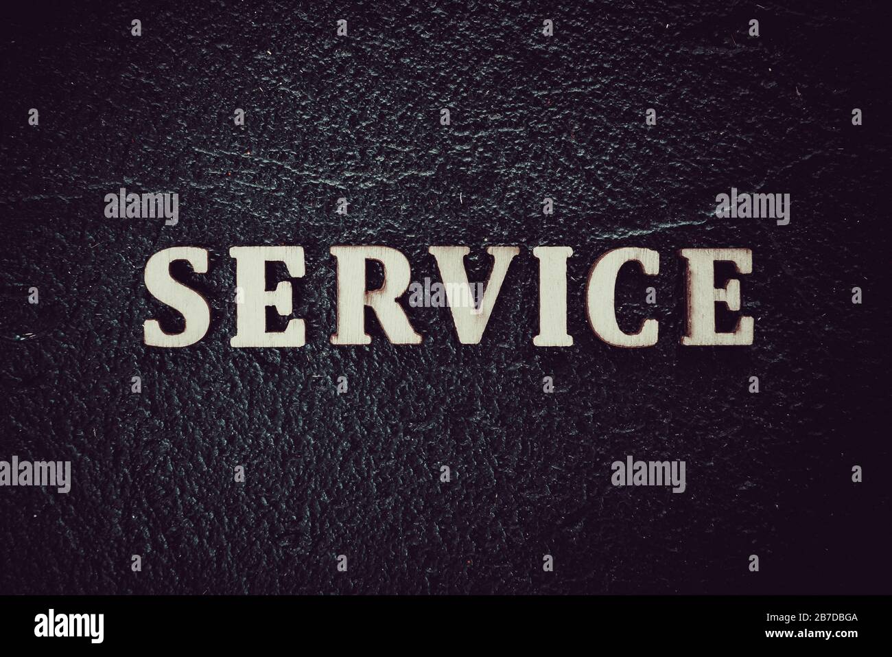 Word service written on black background Stock Photo - Alamy