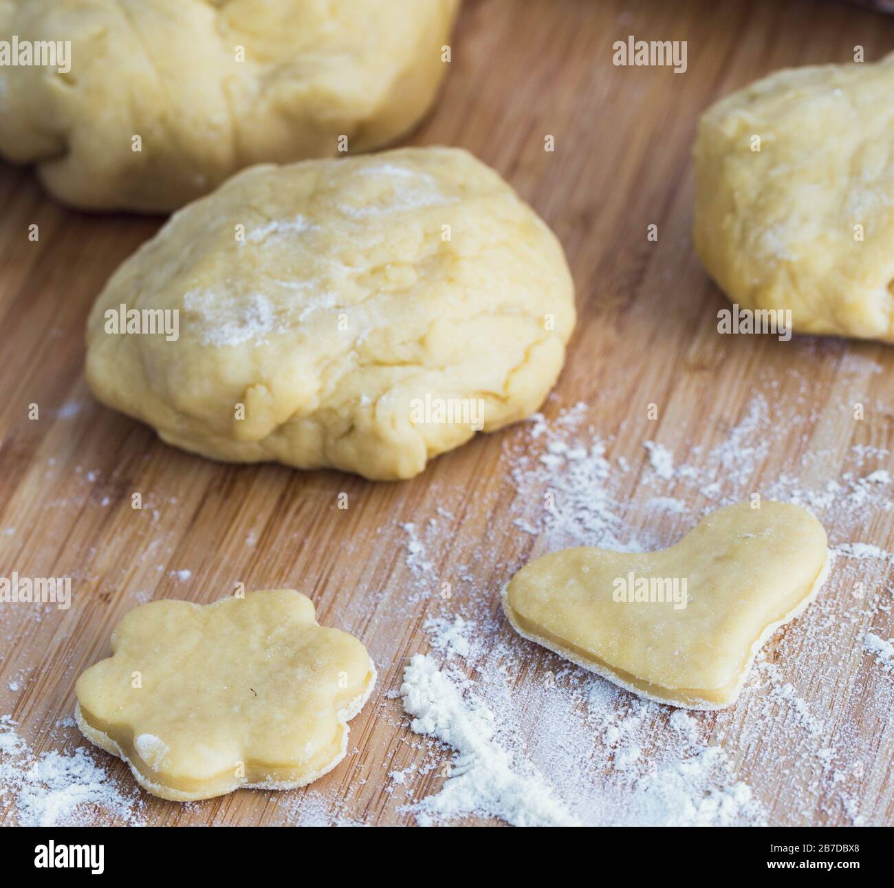 Homemade heart(/flower shaped pastry on the wooden board Stock Photo ...