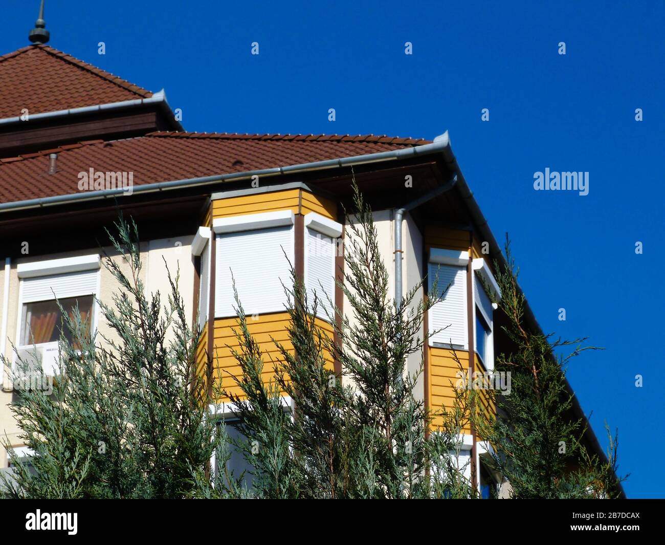 residential multi level condo building. low level view. yellow metal ...