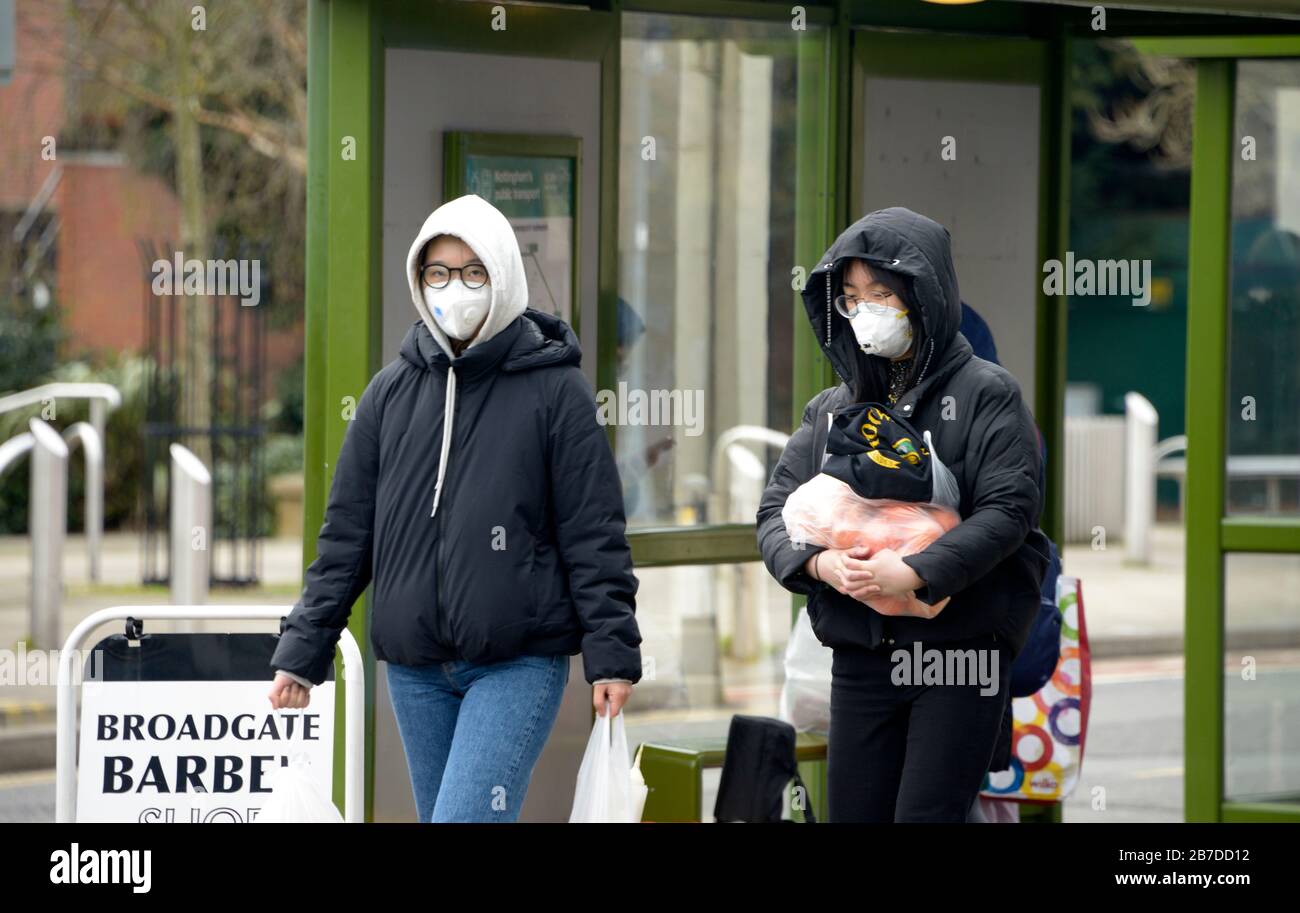 Two young women with face masks hi-res stock photography and images - Alamy