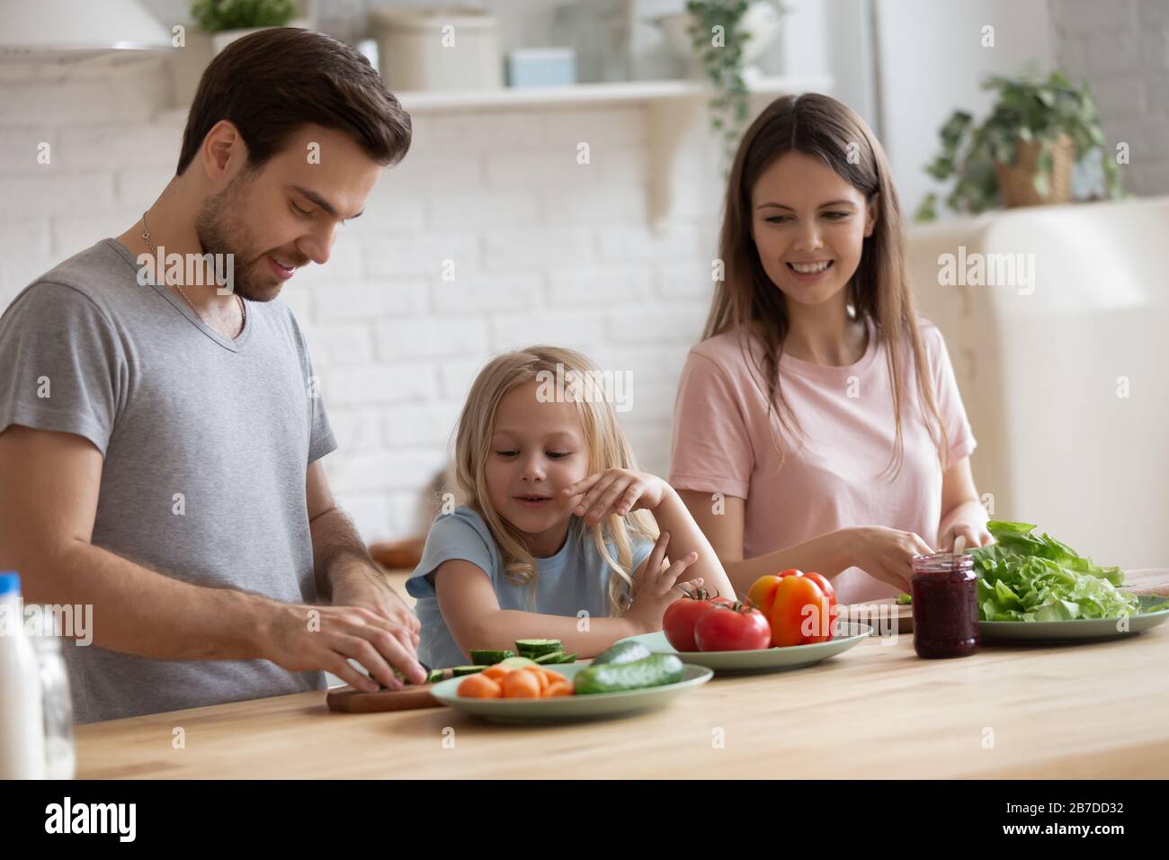 Kid help parents cooking hi-res stock photography and images - Alamy