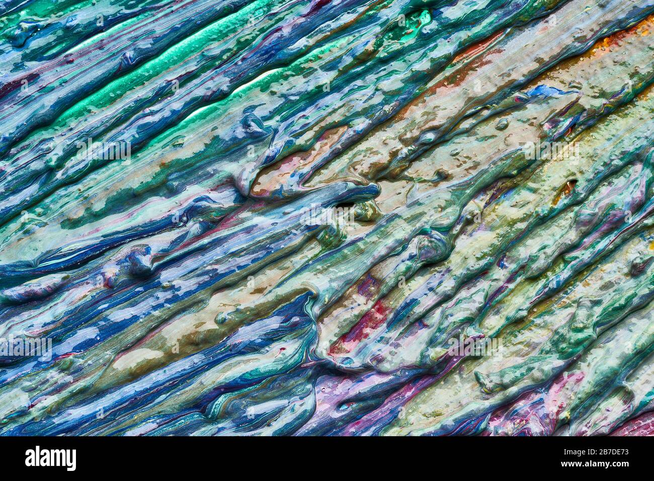 Texture and strokes of multi-color acrylic paint with sparkles on a ...