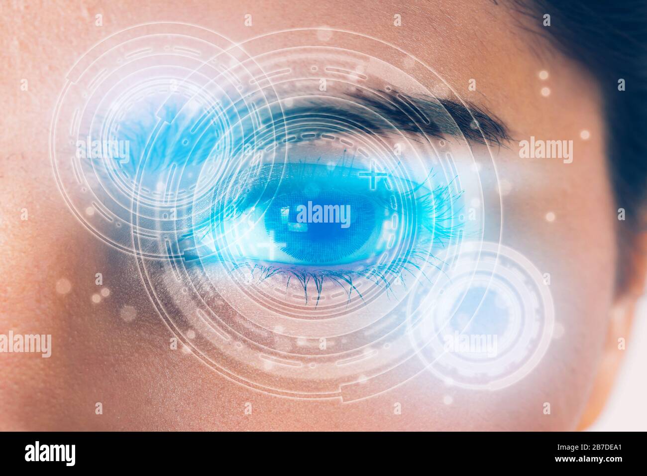 Closeup of beautiful eye woman process scanning with technology, visual ...