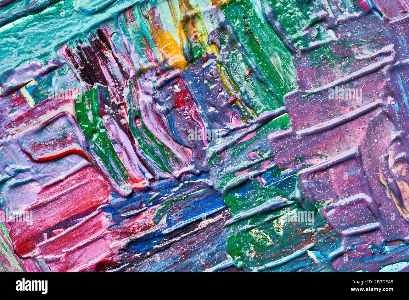 Texture and strokes of multi-color acrylic paint with sparkles on a ...