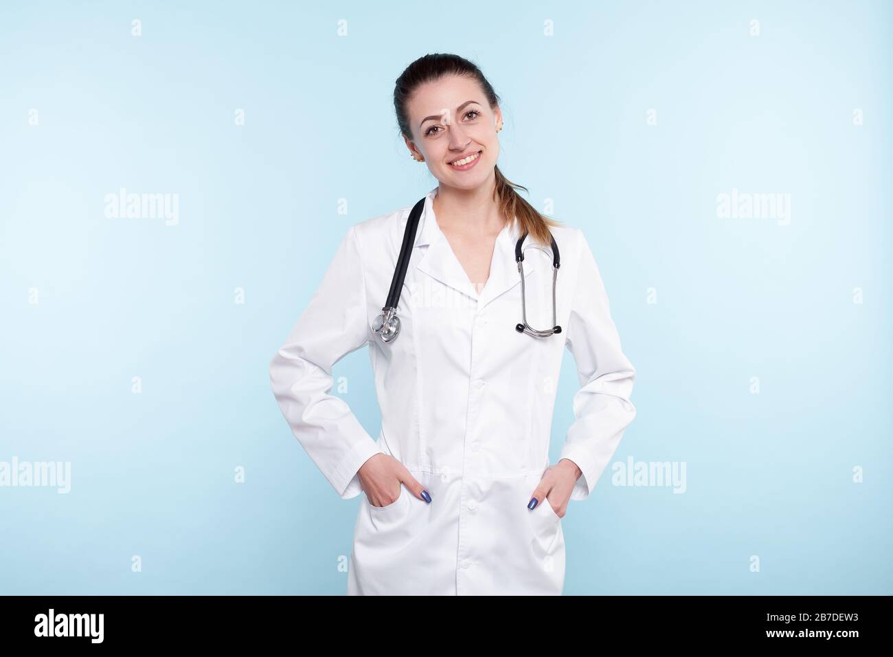 doctor stands at a wall with stethoscope Stock Photo - Alamy