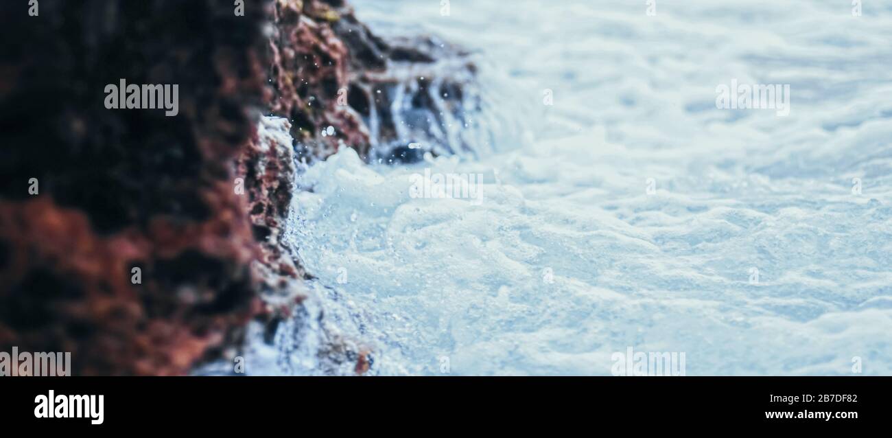Storm in the ocean, sea waves crashing on rocks on the beach coast ...