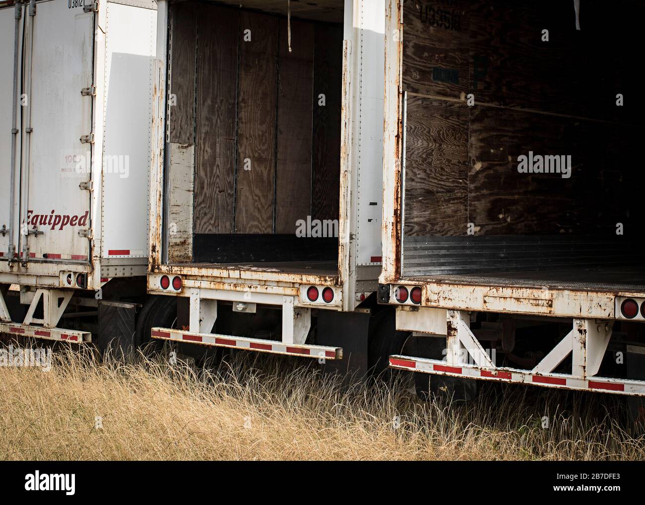 Trailers sit empty on a early summer day in TExas waiting for work and ...