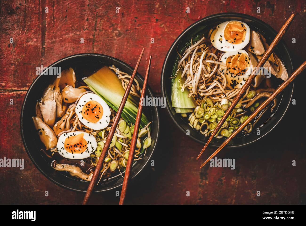 Flat-lay of traditional japanese Ramen bowls with chicken meat and ...