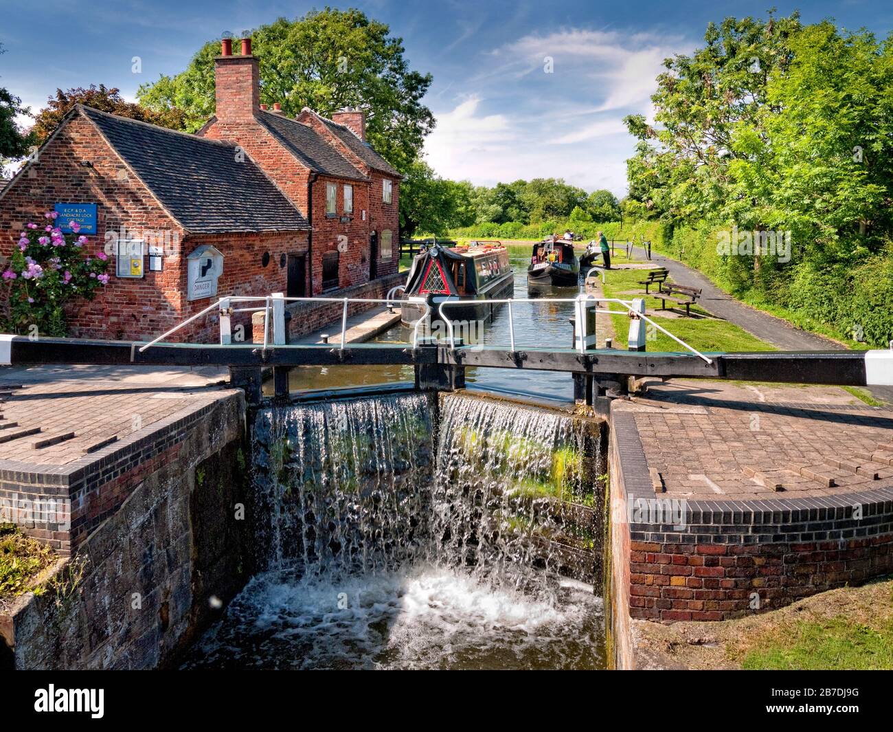 Two narrowboats descending Sandiacre Lock on the Erewash Canal, near ...