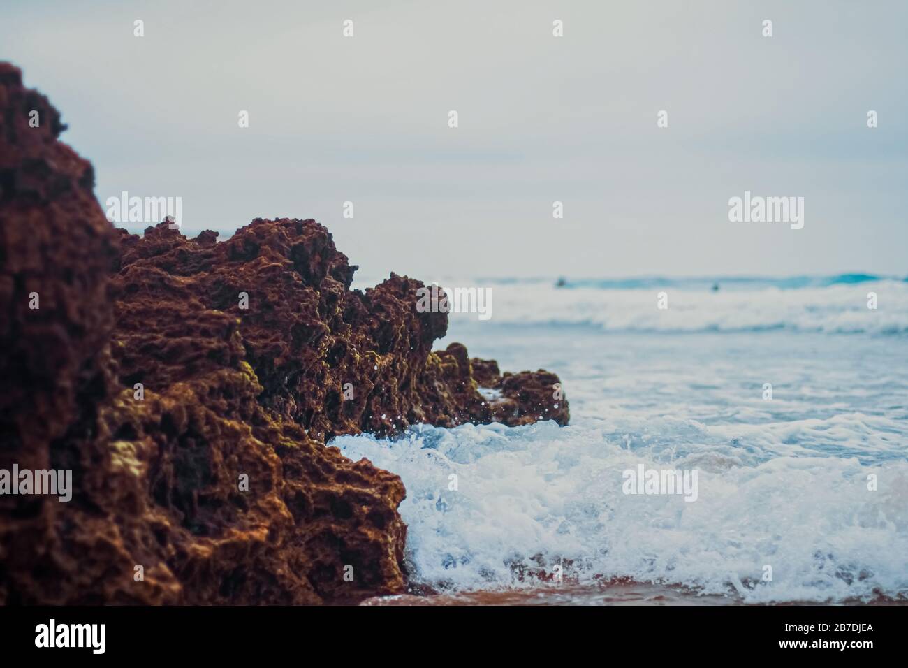 Storm in the ocean, sea waves crashing on rocks on the beach coast ...