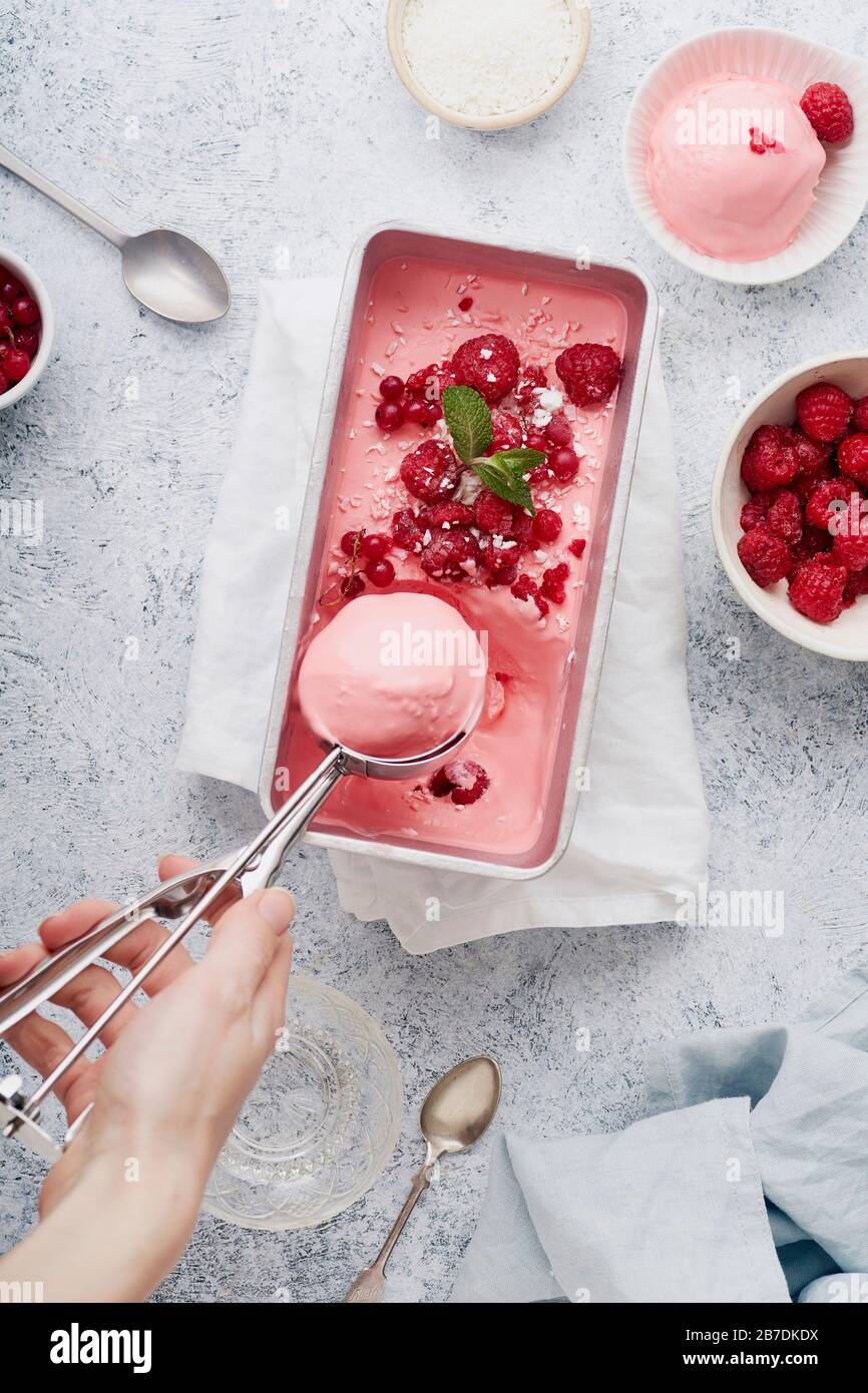 Hand scooping ice cream hi-res stock photography and images - Alamy