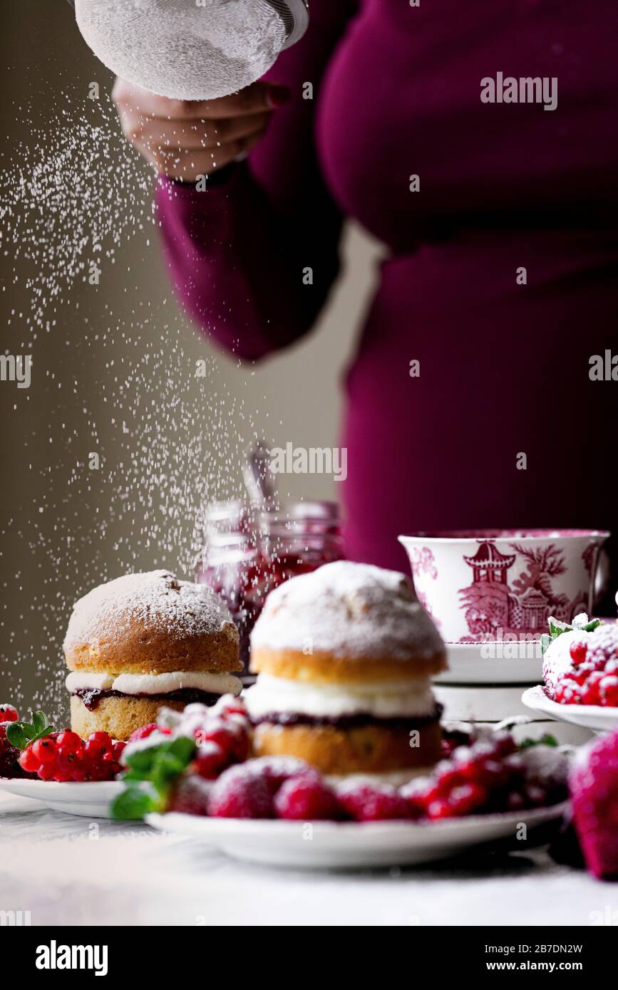 Victoria Sponge Cake with raspberry jam and whipped cream , generously ...