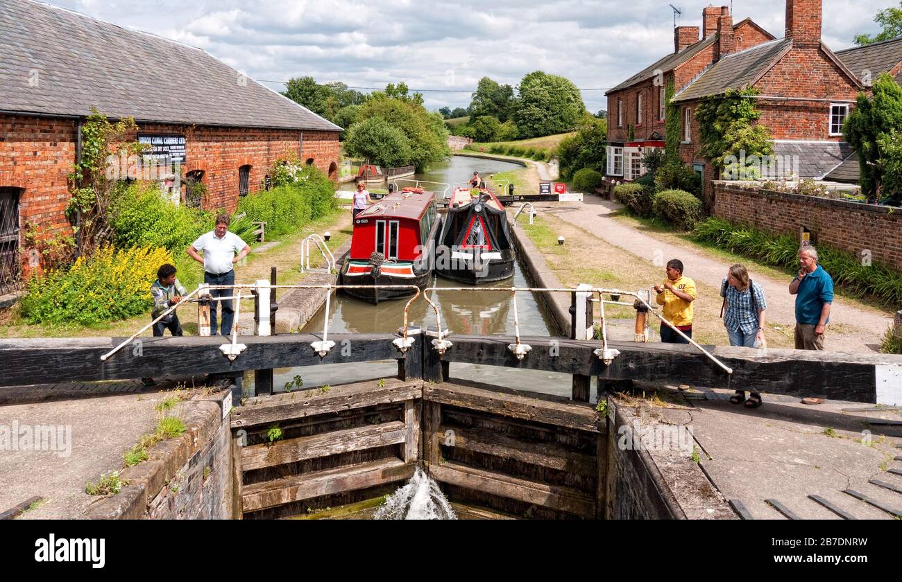 Braunston Lock with narrowboats descending on the Grand Union Canal ...