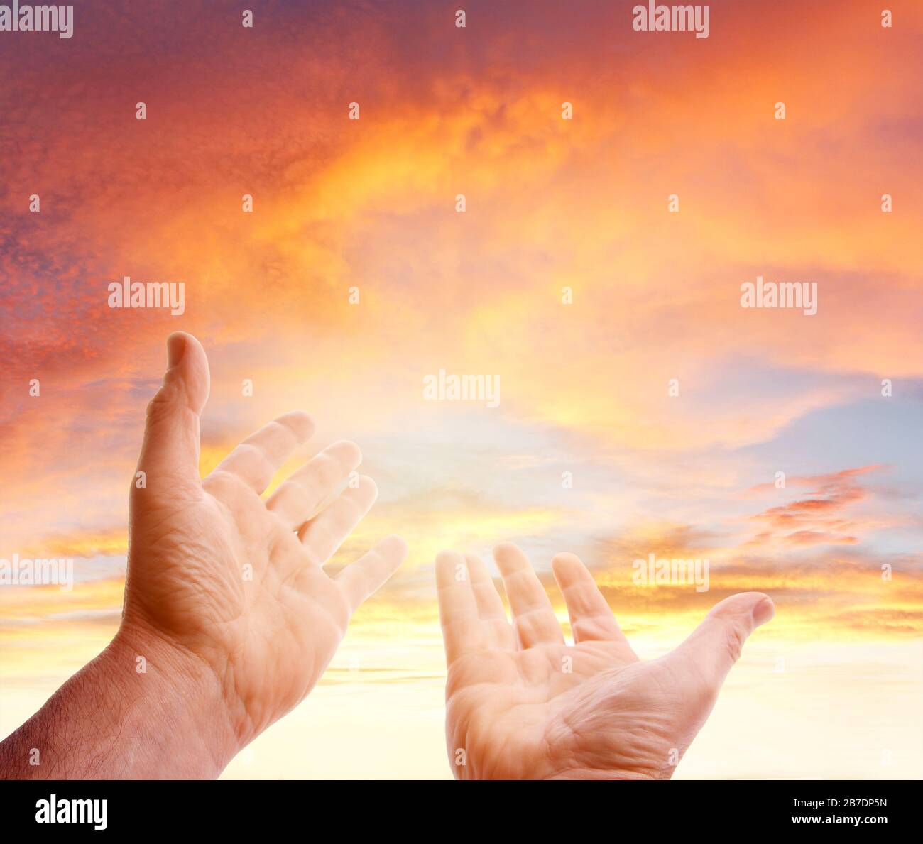 Open hands in the sky Stock Photo - Alamy