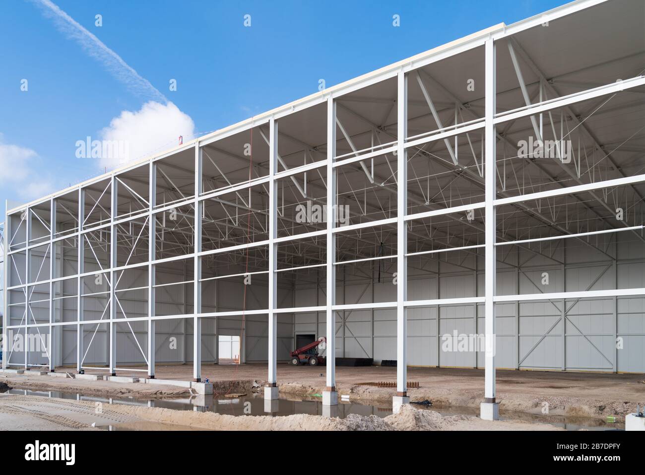 frame of a newly built warehouse against a nice blue sky Stock Photo ...